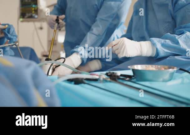 Surgeons team during process operation uterus removal with surgical ...