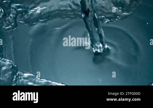 Cold water pouring glass top view closeup. Transparent mineral drink ...