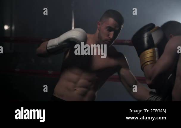 Cinematic slow motion shot of two professional young muscular shirtless ...