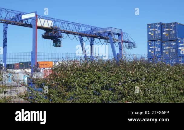 Shipping container crane lift loading heavy stacked cargo shipyard ...