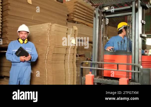 Industry factory workers team in safety uniform and hard hat inspect ...