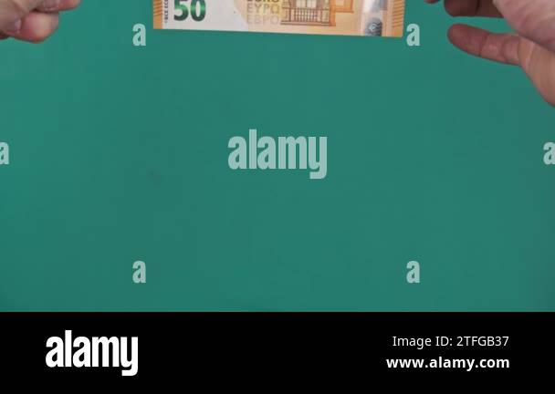 Male Hands Show a Banknote of 50 Euros From Top to Bottom on Green ...