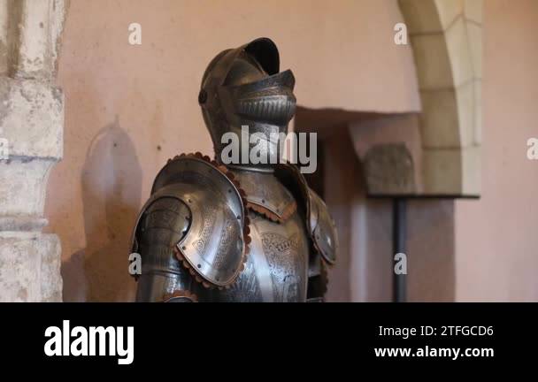 Copper vintage knight armor with a spear from the medieval era in ...
