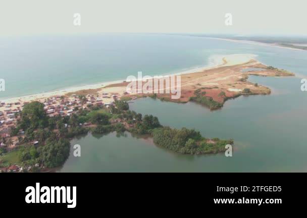 Cape Mount peninsula, a spit of land separating the brackish lagoon ...
