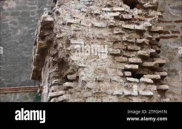 Weathered brick column at Arabic castle wall. Old weathered brick ...
