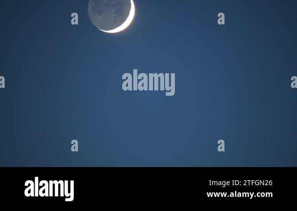 8K 7680X4320.Dark side of the crescent moon.Craters in thin moon with ...