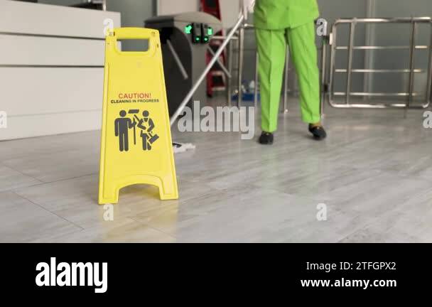 Yellow warning sign wet floor. Sign showing warning of caution wet ...