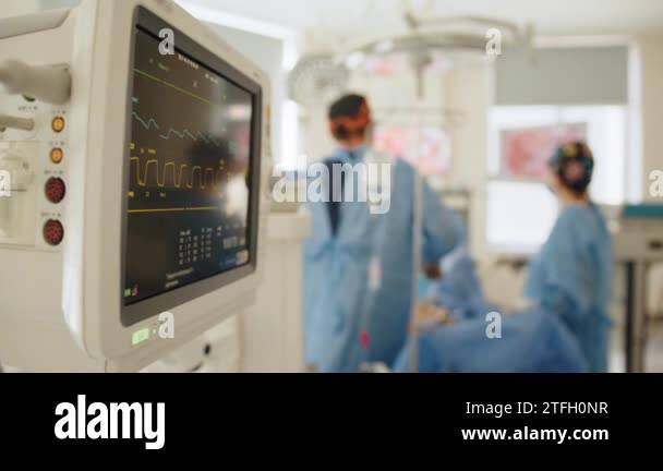 Heart monitor in hospital operating theatre. Heart rate and patient ...