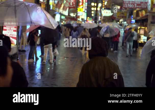 Osaka, Japan-14 April, 2019: Tourist people walking under the rain in ...