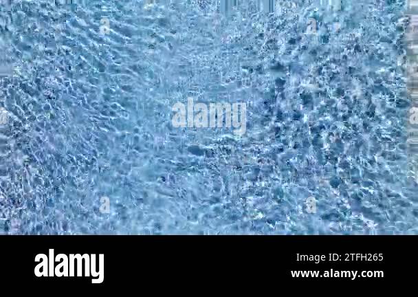 Water surface texture, Slow motion looping clean swimming pool ripples ...