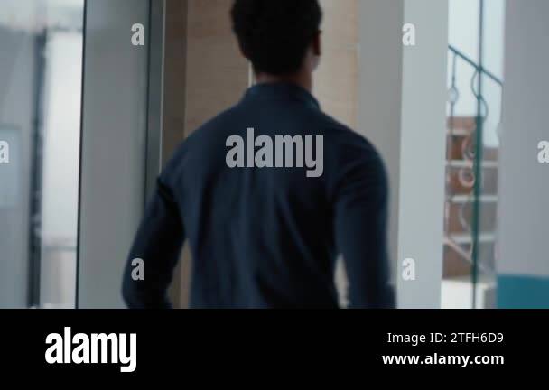 African american businessman leaving work when scary zombies come out ...