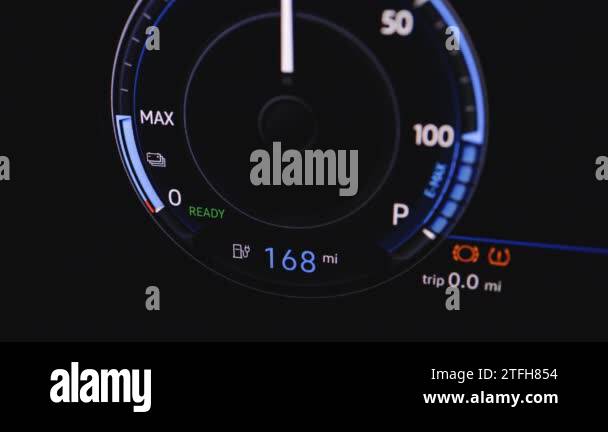 Close up of electric car dashboard display. The battery indicator shows ...