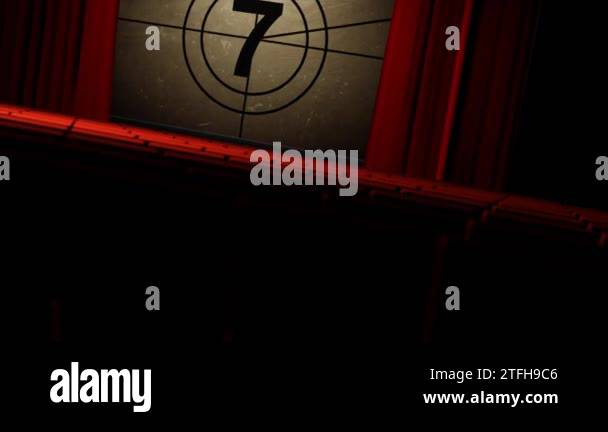 Camera moving toward movie theater countdown screen. After zero screen ...