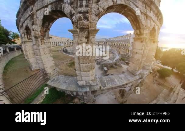 Pula Amphitheater at sunset, also known as Coliseum of Pula, is a well ...