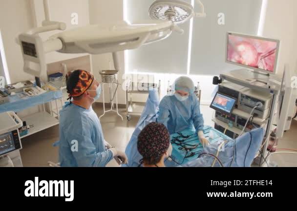 Medical Team Performing Surgical Operation in Modern Operating Room ...