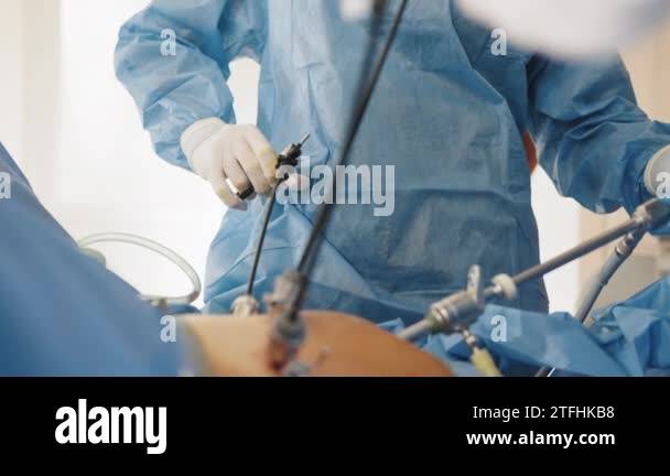 Operation using laparoscopic equipment. The surgeons doing laparoscopic ...