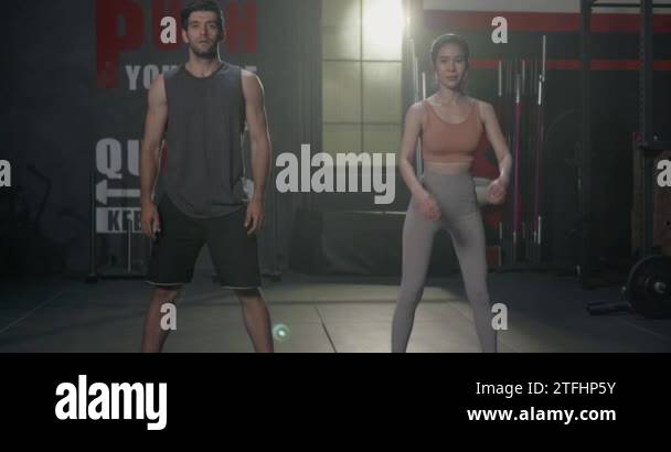 Two Muscular young Caucasian man and Asian woman doing laughing ...