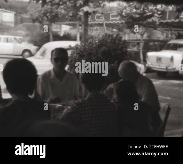 Isola d'elba, Italy june 1964: Memories family lunch scene in 60s. Shot in black and white Stock ...