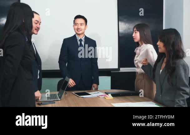 Business people join punching fists bump hands as team their meeting ...