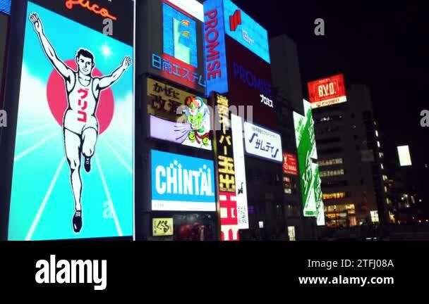 Osaka, Japan-14 April, 2019: People visit famous neons Glico Running ...