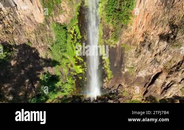 Waterfall at scenic gorge canyon. Peaking waterfall landscape. Nature ...