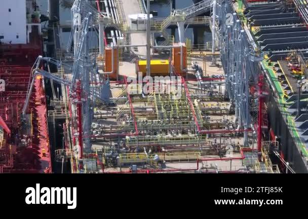 Liquid Cargo Transporter Ship Unloading Crude Oil to a Fuel Depot Stock ...