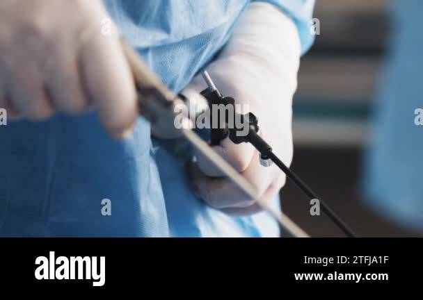 Operation using laparoscopic equipment. The surgeons doing laparoscopic ...