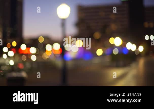 Out of focus background plate of bokeh city lights with streetlamp on ...