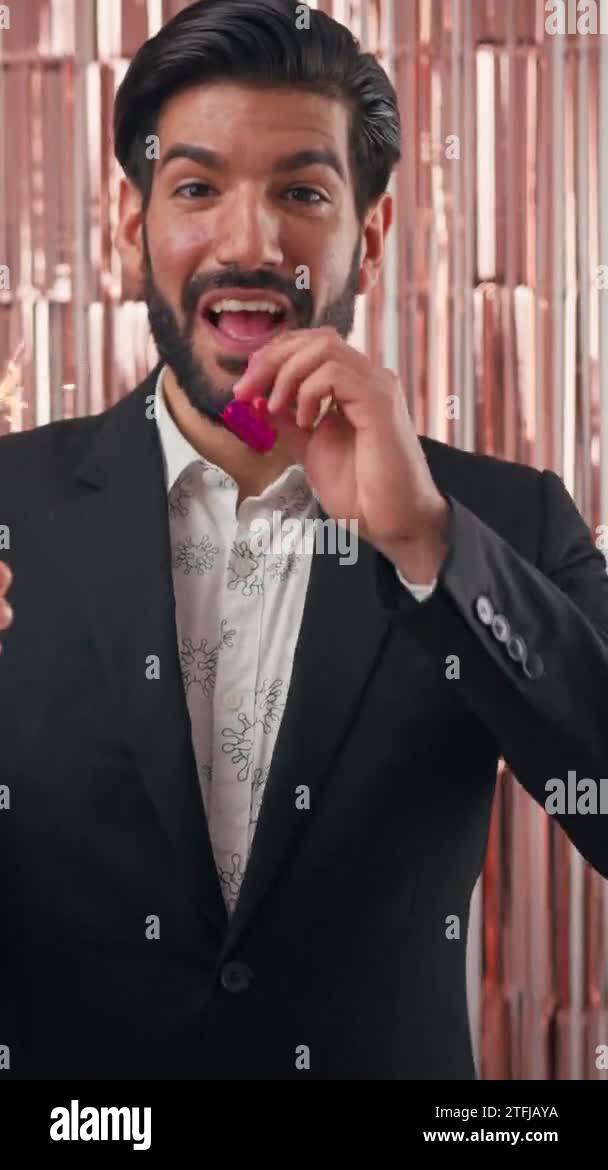 Chic handsome bearded Cuban man in his 30s in elegant suit celebrating ...