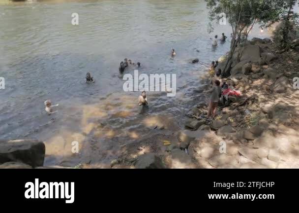 Kampot - Cambodia - 04 -20- 2022 - Group of khmer people taking a bath ...