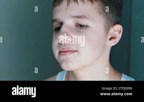 Close-up Face of an Embarrassed Shy Teenager with Downcast, Blinking ...