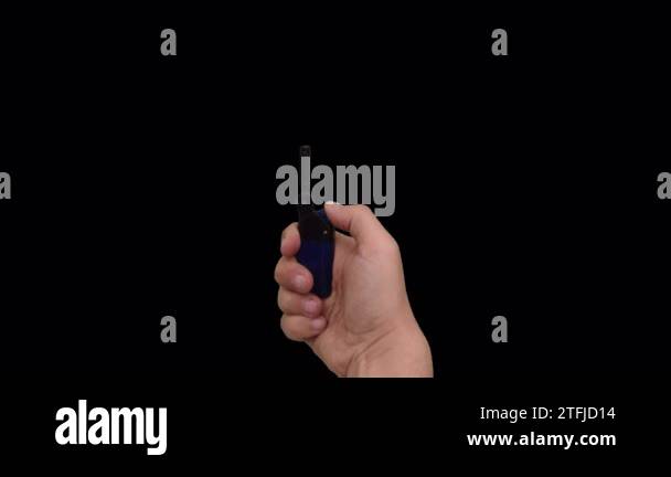 8K 7680x4320 4320p.Man lighting fire with lighter.Male hands on ...