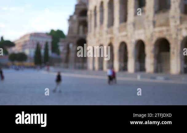 Blurred background of Roman colosseum in Europe with people walking ...
