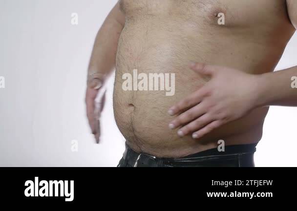 fat man hitting his belly with hands: overweight, obesity, diet ...