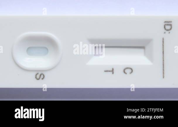 Liquid drops into cassette of Coronavirus Covid-19 and showing Covid-19 ...