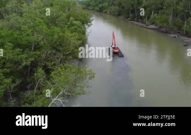 Seberang Perai, Penang, Malaysia - Sep 02 2021: Backhoe river swamp ...