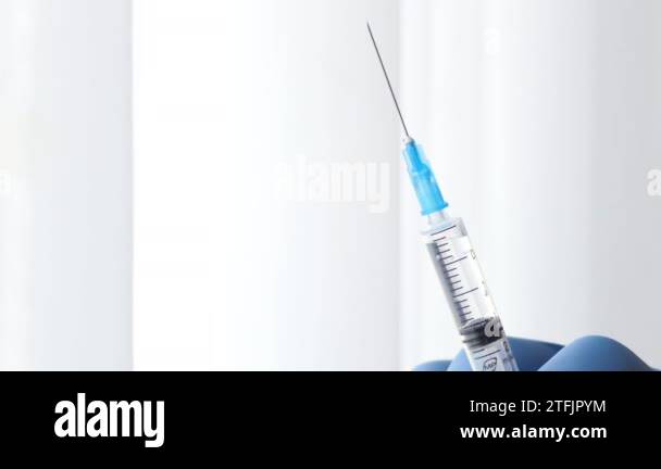 Close Up of injection liquid being in syringe. Medication drug needle ...