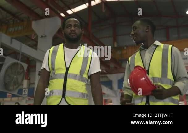 Engineering and worker man walking take off the safety helmet and ...