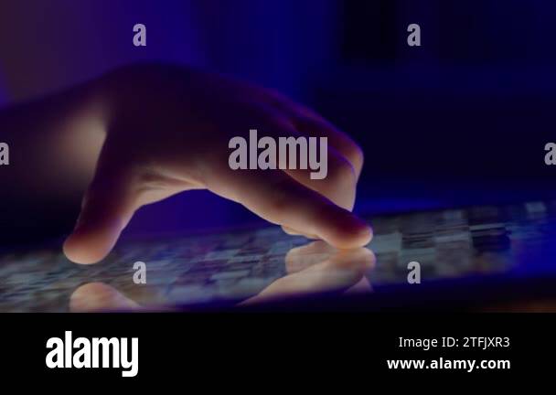 Close-up child finger scrolling screen on touchpad, flips through pages ...