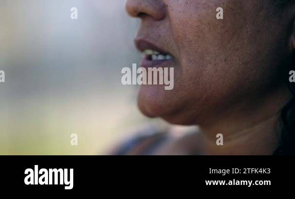 Stressed mature woman smoking cigarette. Anxious person biting lip ...
