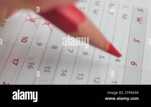 Write the day on a paper calendar with a red pen. A very important date ...