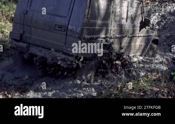 Wheels tires in mud. Dirty Car on bad road. Motion the wheels tires and ...
