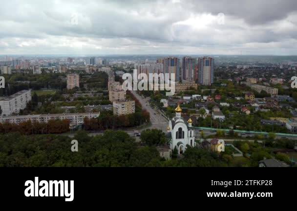 White christian church with golden dome and cross from sky, aerial ...
