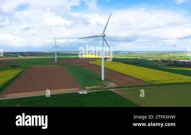 Wind turbines in the middle of the countryside with its fields of ...