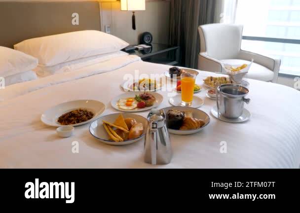Breakfast in bed in hotel. Room service in modern luxury resort ...