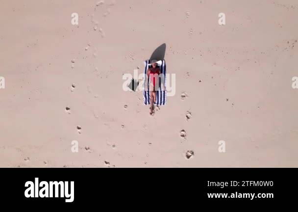 Drone Of Woman Sunbathing In Swimsuit On Entalula Beach Stock Video ...