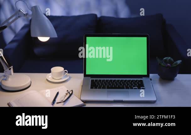 Close up zooming shot of modern chroma key green screen laptop computer ...