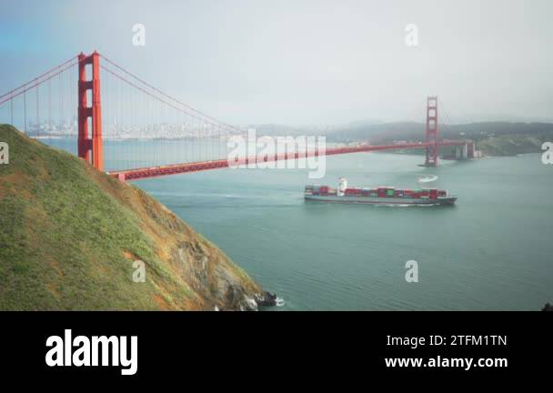 Cargo ship passing under San Francisco Golden Gate Bridge. Vessel in ...