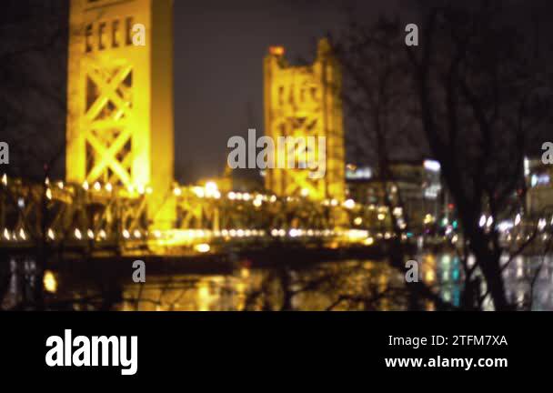 Blurred video background of Gold Tower Bridge in Sacramento at night ...