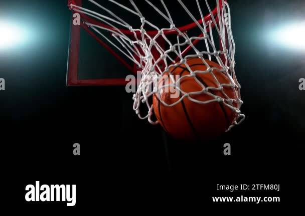 Super slow motion of basketball player hitting the basket. Filmed on ...
